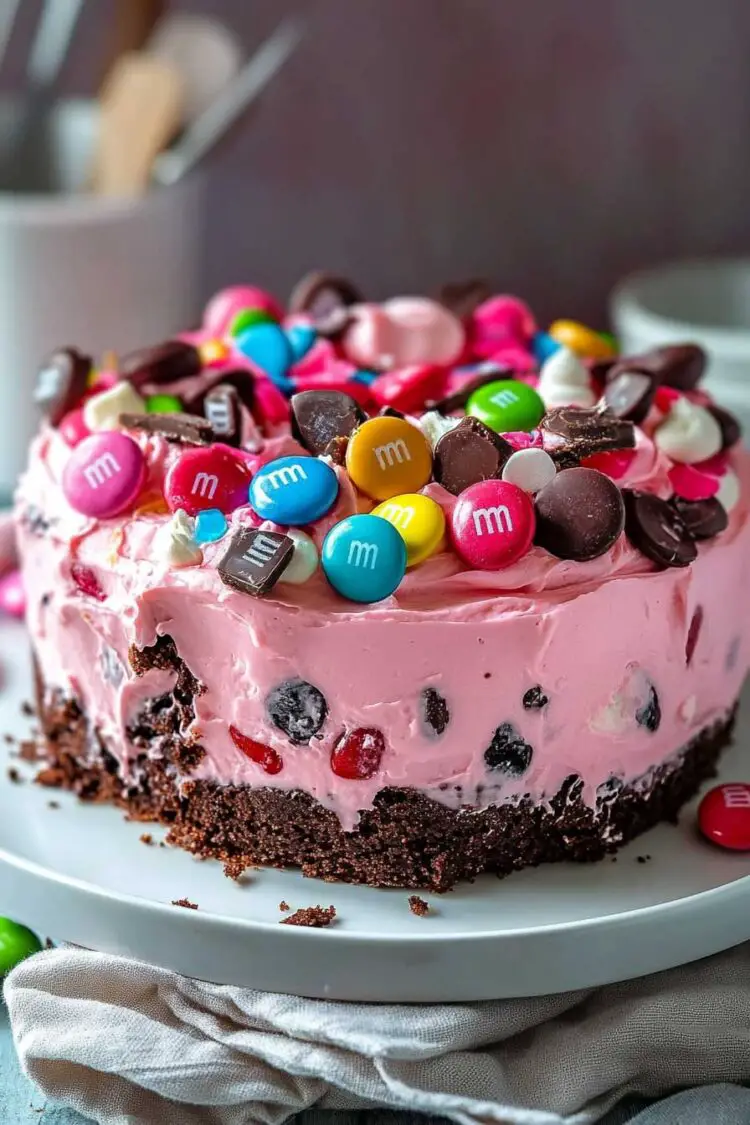 Pink Paradise No-Bake M&M Snickers Cheesecake - Dessert Hungry