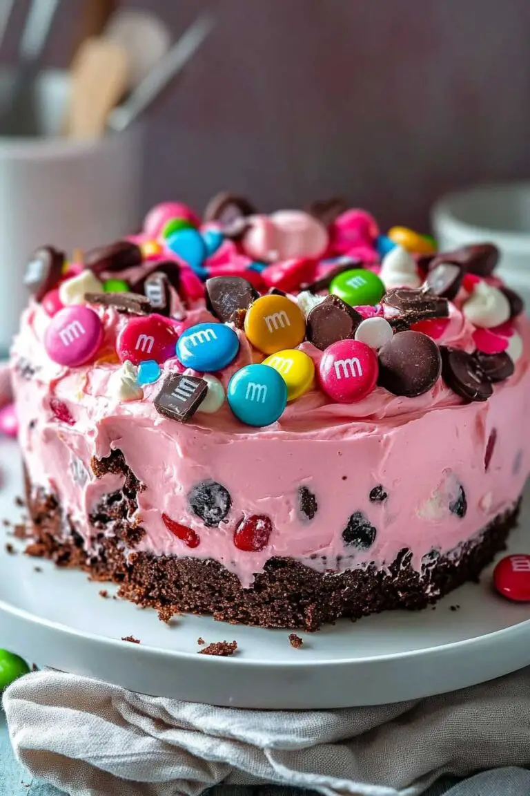 Pink Paradise No-Bake M&M Snickers Cheesecake - Dessert Hungry