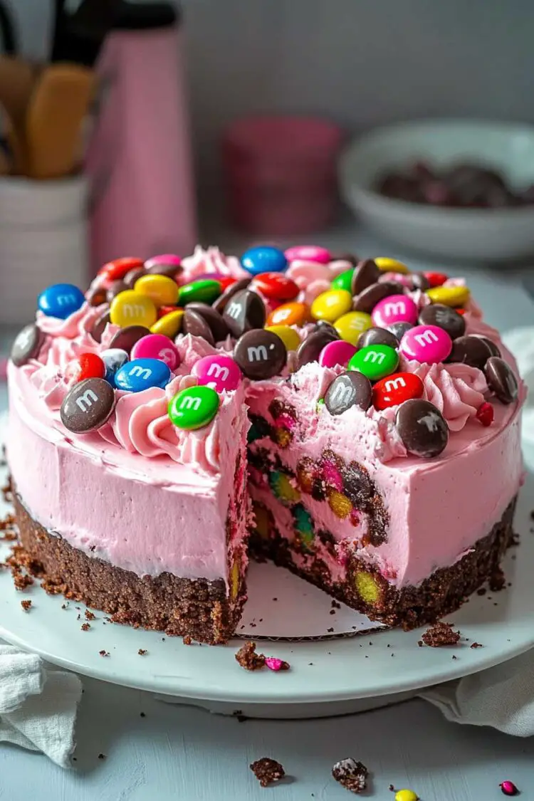 Pink Paradise No-Bake M&M Snickers Cheesecake - Dessert Hungry